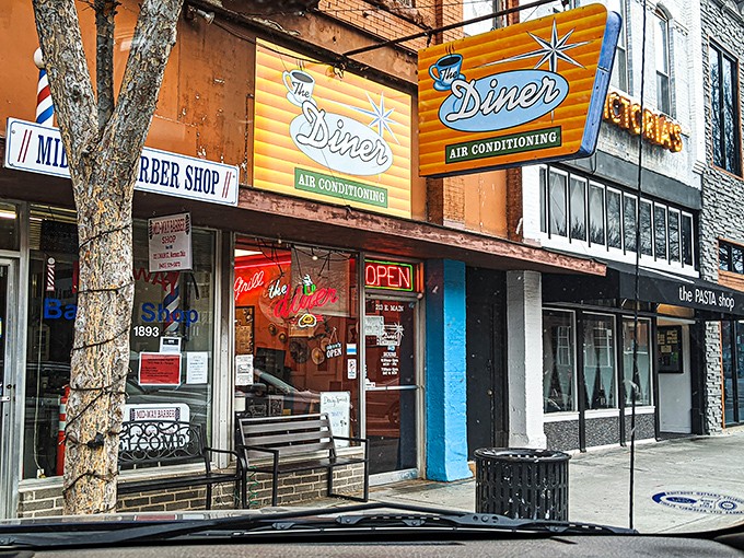 That iconic orange and teal sign doesn't just promise air conditioning&mdash;it's announcing your arrival at breakfast paradise on Main Street.
