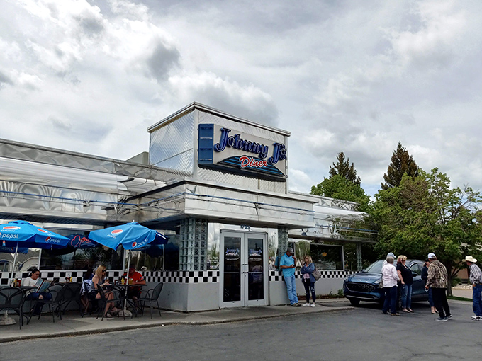 The classic blue-and-white facade of Johnny J's Diner stands as a beacon of comfort food in Casper, Wyoming&mdash;checkerboard trim signaling breakfast paradise within.