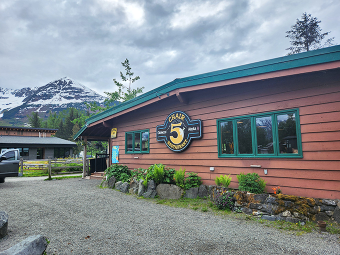 Chair 5 stands proudly against Alaska's dramatic mountain backdrop, its rustic wooden exterior promising comfort and culinary surprises within.