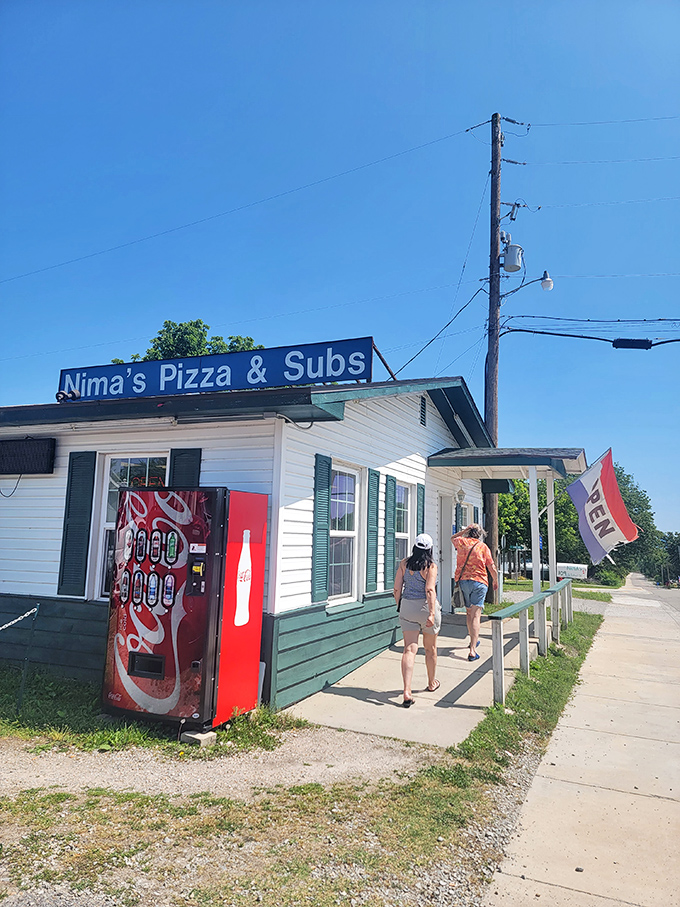 Welcome to Nima's, where the pizzas are hot and the frills are... well, let's just say they're as scarce as a snowball in July.