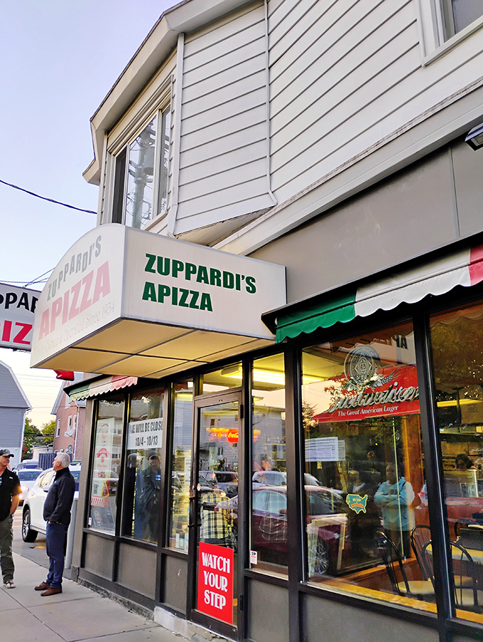 A slice of Americana! Zuppardi's Apizza stands proud, its unassuming exterior hiding a world of cheesy, saucy delights within. 