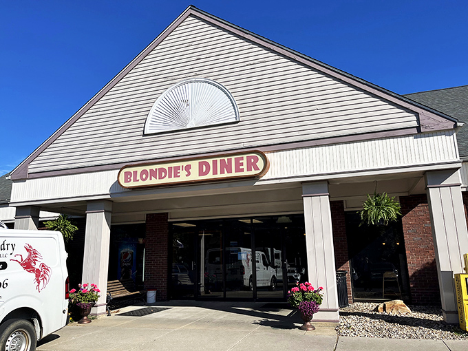 Welcome to flavor town! Blondie's Diner stands proud against the Connecticut sky, promising a feast that'll make your taste buds do a happy dance.