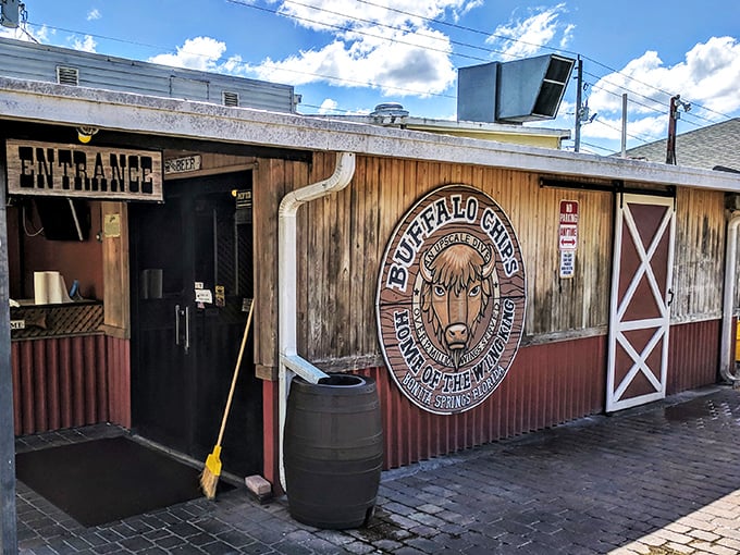The unmistakable red exterior of Buffalo Chips, where that magnificent buffalo mural isn't just decoration&mdash;it's a promise of what awaits your taste buds inside.
