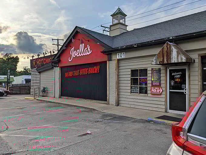Welcome to flavor town! Joella's exterior promises a spicy adventure with its bold red facade and cheeky slogan.