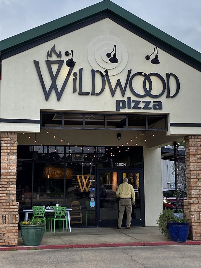 Welcome to Wildwood Pizza, where the exterior is as inviting as the aroma wafting through the door. It's like a pizza-scented beacon calling you home.
