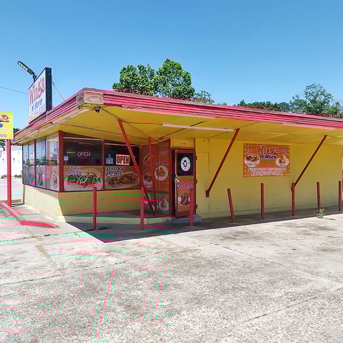 The sunshine-yellow exterior with bold red trim isn't trying to win architectural awards&mdash;it's saving all its energy for what's cooking inside.