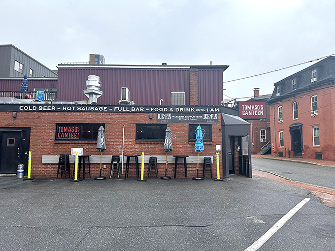 A brick facade that screams "hidden gem." Tomaso's Canteen: where culinary adventures begin and diet plans go to die.