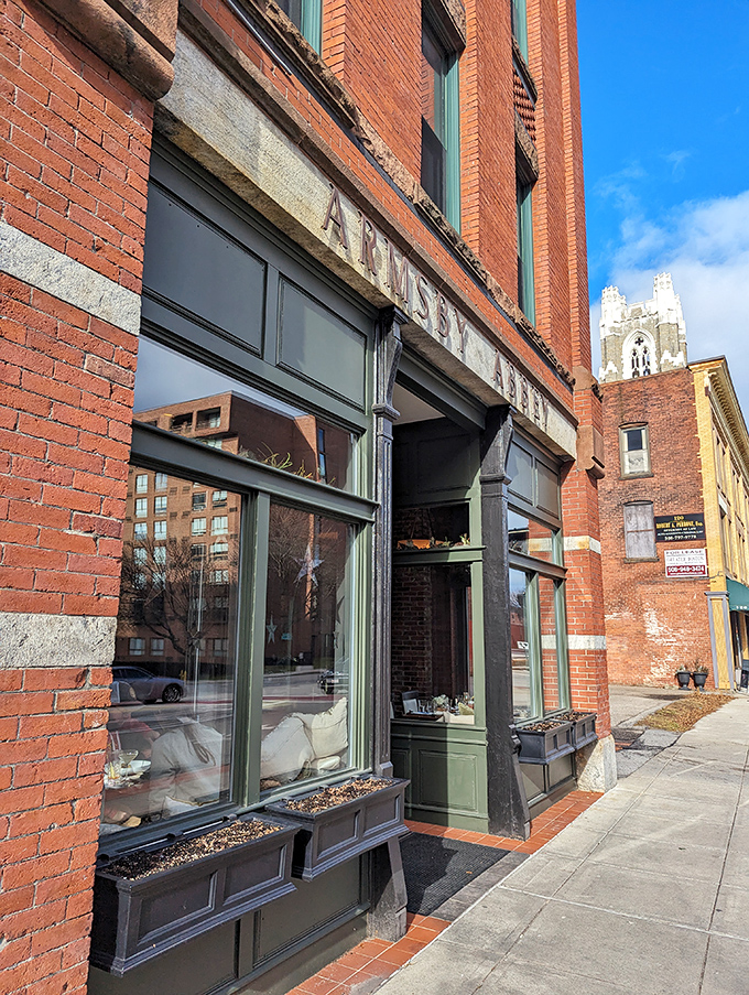The historic brick fa&ccedil;ade of Armsby Abbey stands as Worcester's culinary beacon, its green trim and weathered sign promising gastronomic treasures within.