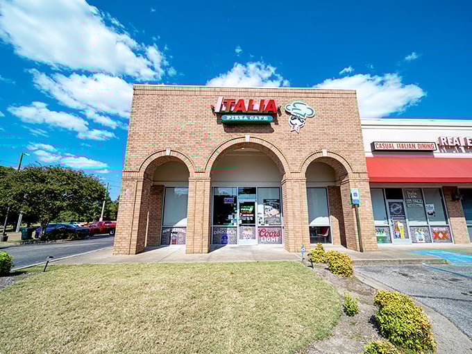 Welcome to pizza paradise! Italia Pizza Cafe's unassuming exterior hides a world of cheesy delights, proving you should never judge a book by its brick-and-mortar cover.