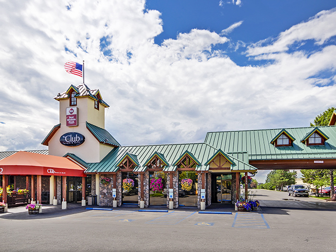A beacon of deliciousness! The Club Tavern and Grill stands tall, its yellow exterior and red awning beckoning hungry travelers like a culinary lighthouse in the heart of Bozeman. 