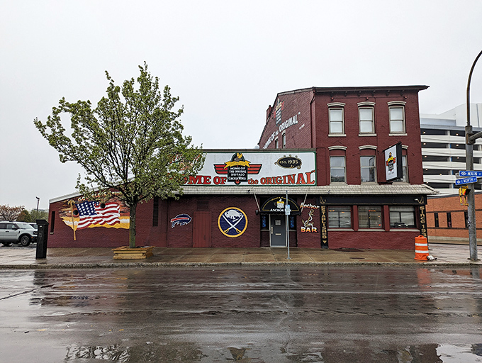 The unassuming red brick exterior of Anchor Bar proudly declares itself "Home of the Origin" &ndash; where culinary history was made one fateful night in 1964.