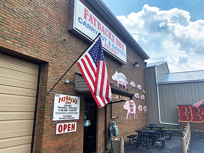 The unassuming brick exterior of Fatback's BBQ hides culinary treasures within. Those pig cutouts aren't just decoration&mdash;they're a roadmap to happiness.