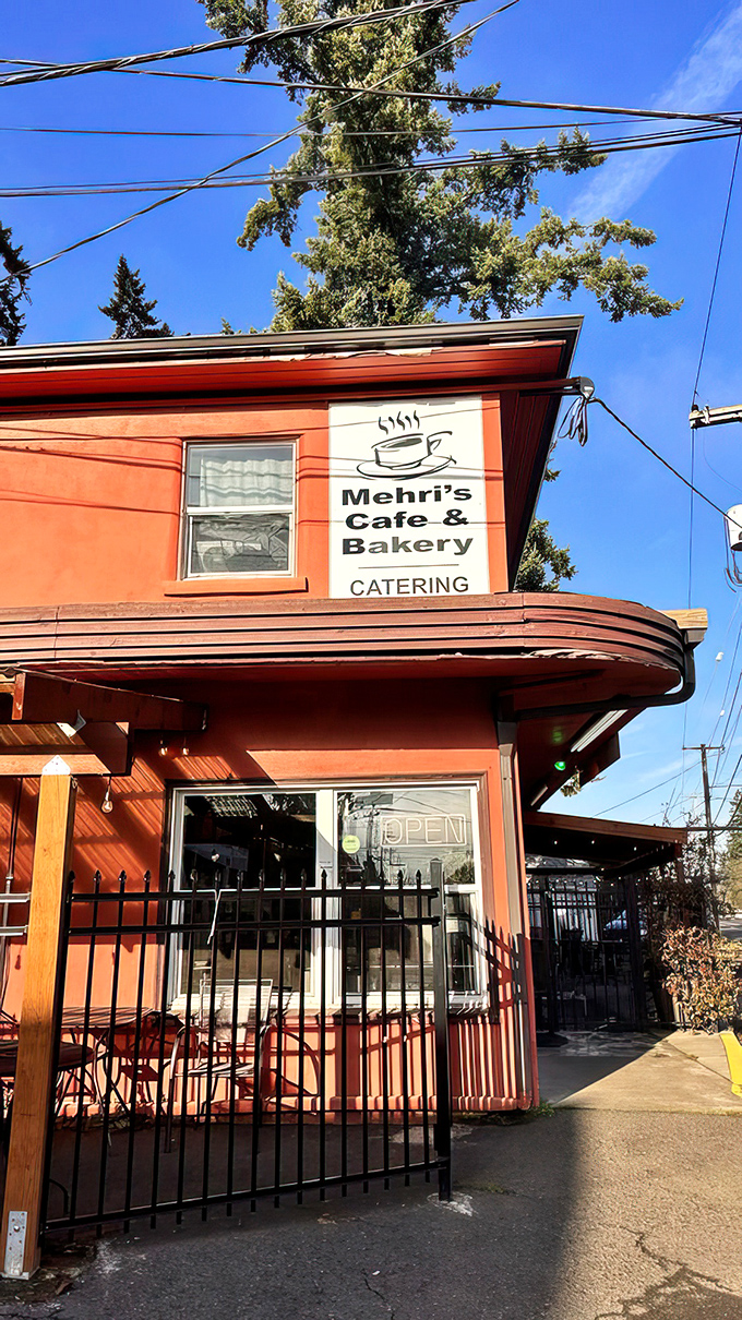 Welcome to flavor town! Mehri's Cafe & Bakery's cherry-red exterior is like a beacon for hungry souls in Portland.
