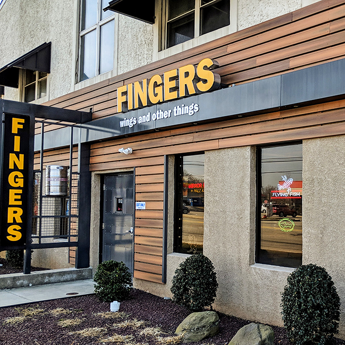 "Welcome to flavor town!" This unassuming exterior hides a world of wing-tastic delights, proving you can't judge a book by its cover &ndash; or a restaurant by its siding.