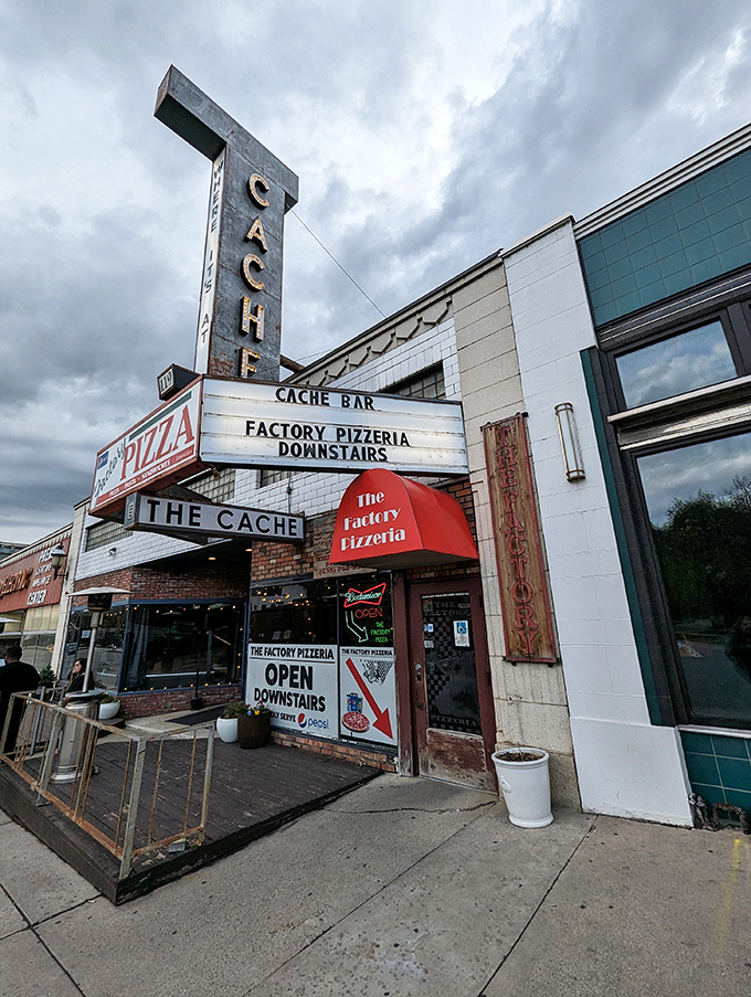 Welcome to pizza paradise! The Factory Pizzeria's vintage sign promises a slice of history with every bite.