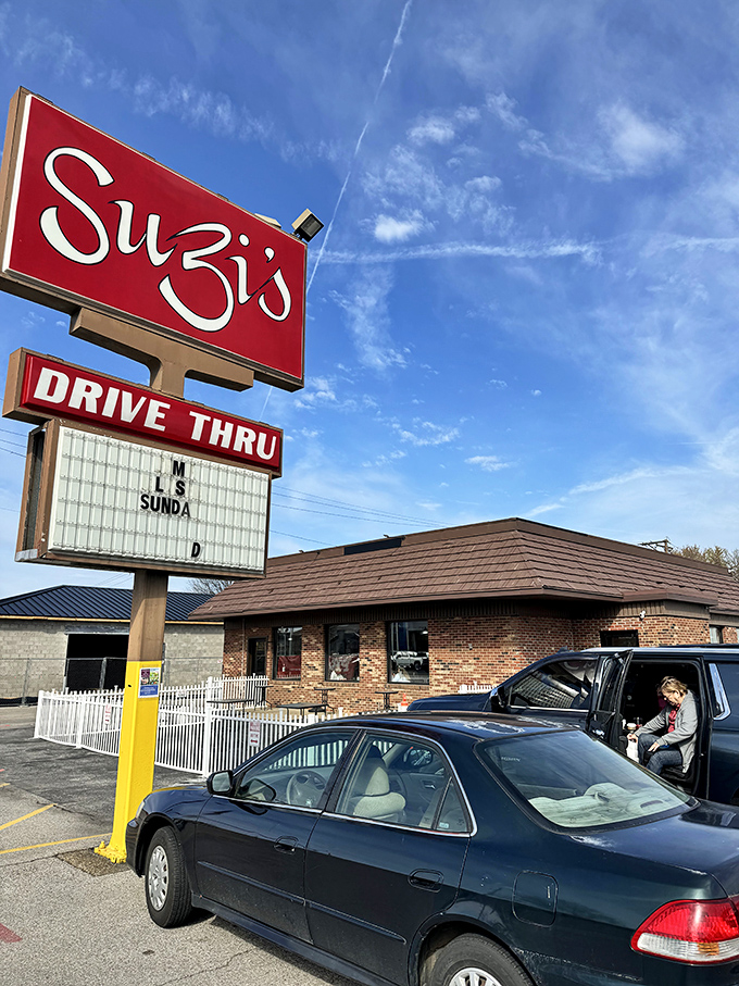 A beacon of comfort food hope! Suzi's red sign shines like a lighthouse, guiding hungry souls to a harbor of heavenly biscuits and gravy.