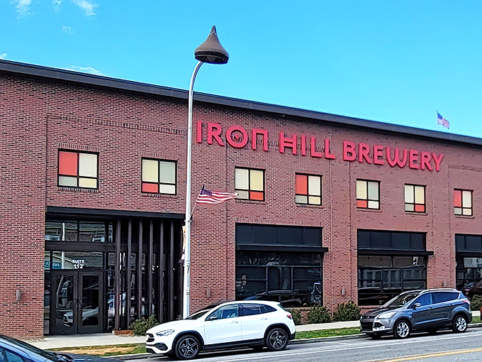 Iron Hill's brick facade glows at twilight, a beacon of craft beer and culinary promise in the heart of Hershey. Like finding an oasis after a chocolate factory tour.