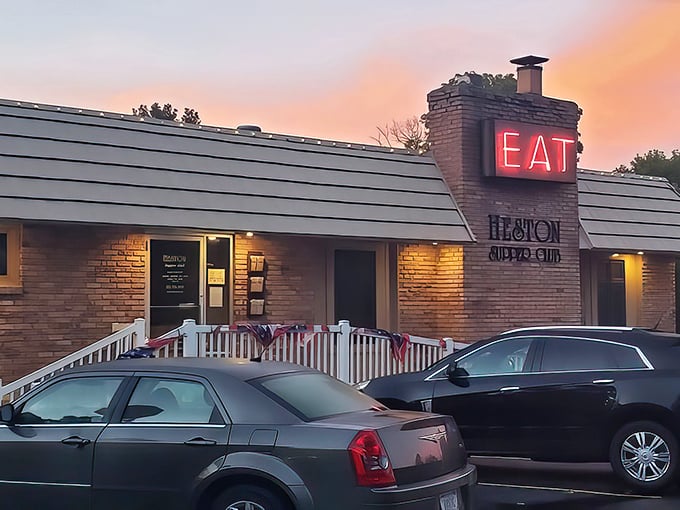 "EAT" indeed! This neon sign isn't just an invitation; it's a command from the culinary gods. Heston Supper Club's brick exterior promises Midwest charm with a side of deliciousness. 