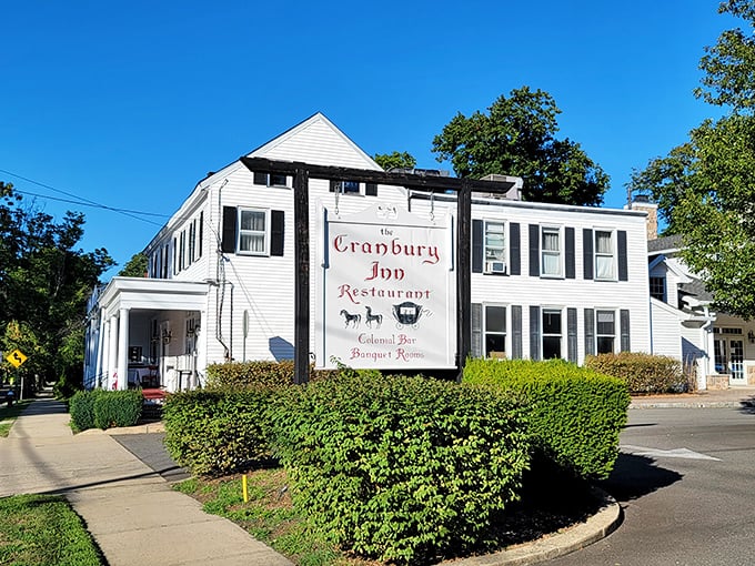 A slice of Americana served with a side of history! The Cranbury Inn stands proud, its white clapboard exterior a beacon for hungry time travelers.