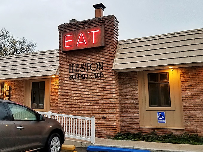 "EAT" indeed! This neon sign isn't just an invitation; it's a command from the culinary gods. Heston Supper Club's brick exterior promises Midwest charm with a side of deliciousness.