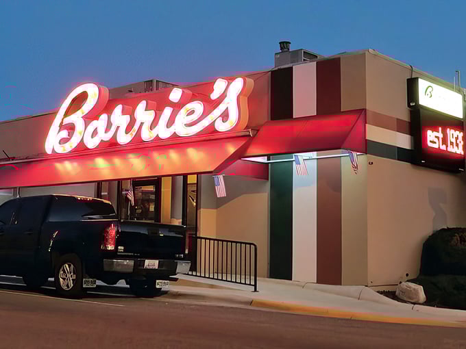 "Borrie's" in neon: a siren call for steak lovers. This sign doesn't just glow; it beckons with the promise of meaty delights. 