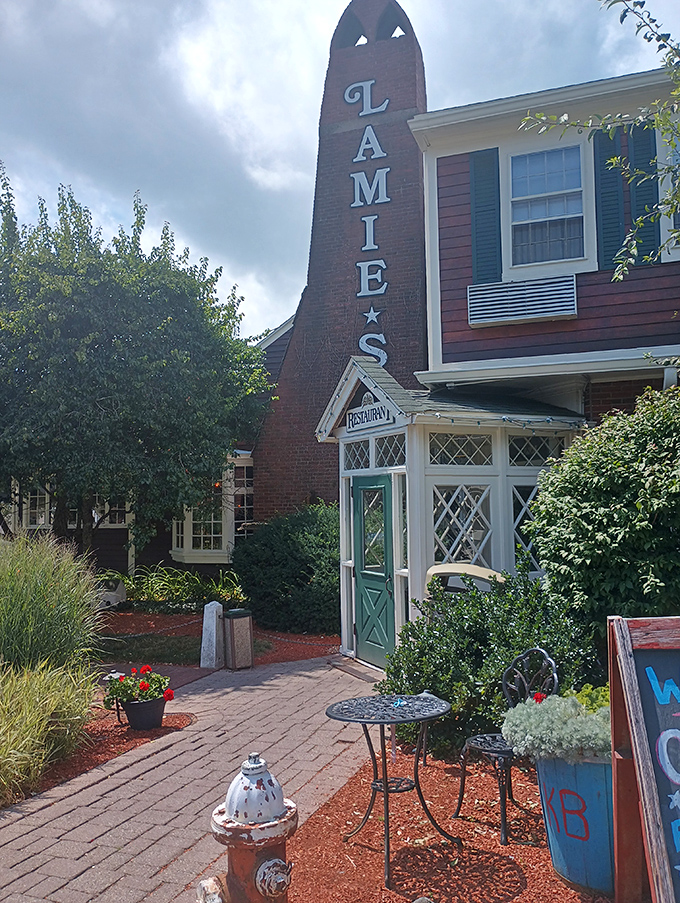 A beacon of culinary delight! The Old Salt's exterior promises a feast for the senses, with its charming New England facade and inviting red accents.