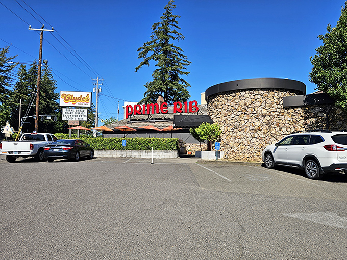 A beacon of beefy bliss! Clyde's neon sign promises prime rib paradise, while its Tudor-style exterior whispers of old-world charm.