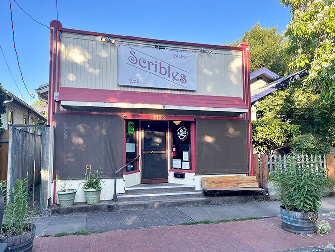 Welcome to sandwich paradise! Scribles Bistro & Deli's charming exterior promises a feast for the senses, with its inviting red trim and vintage-style sign.