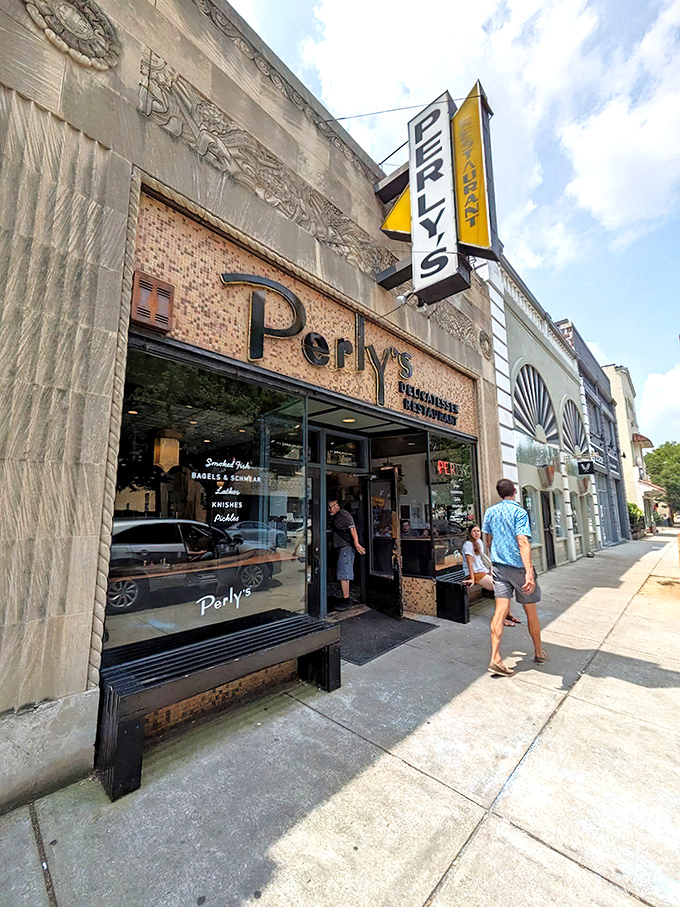 Perly's iconic storefront stands proud on Grace Street, its vintage yellow sign beckoning hungry Richmonders like a beacon of delicatessen delight.
