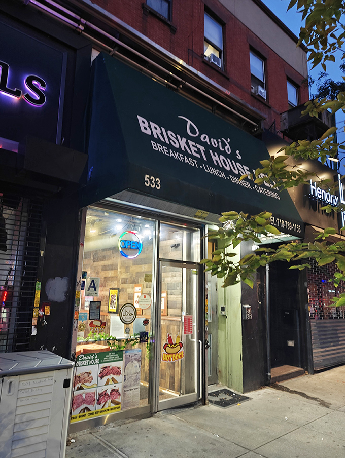 A beacon of brisket brilliance! David's Brisket House stands proud, its green awning a siren call to sandwich lovers everywhere.