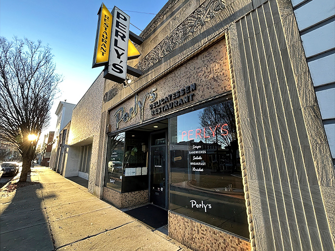 Perly's iconic storefront stands proud on Grace Street, its vintage yellow sign beckoning hungry Richmonders like a beacon of delicatessen delight.