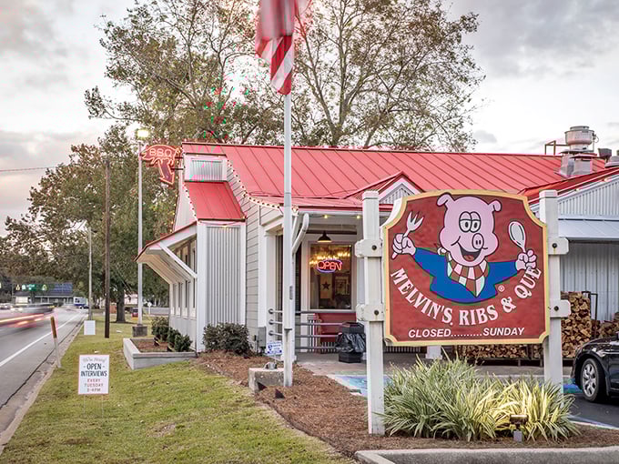 Welcome to barbecue heaven! Melvin's charming exterior, complete with a grinning pig mascot, promises smoky delights within.
