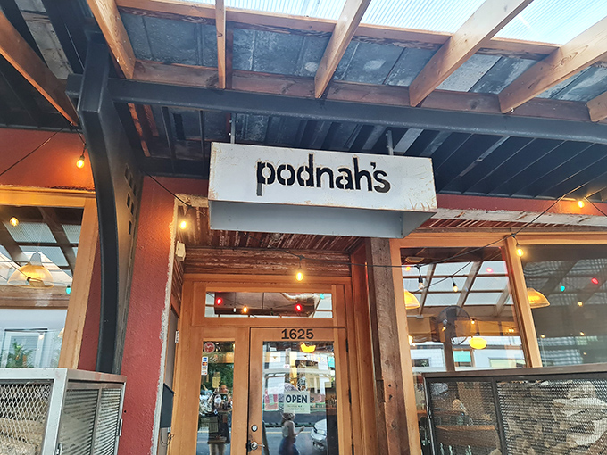 Welcome to barbecue nirvana! Podnah's rustic exterior promises smoky delights within, like a meaty treasure chest waiting to be opened.