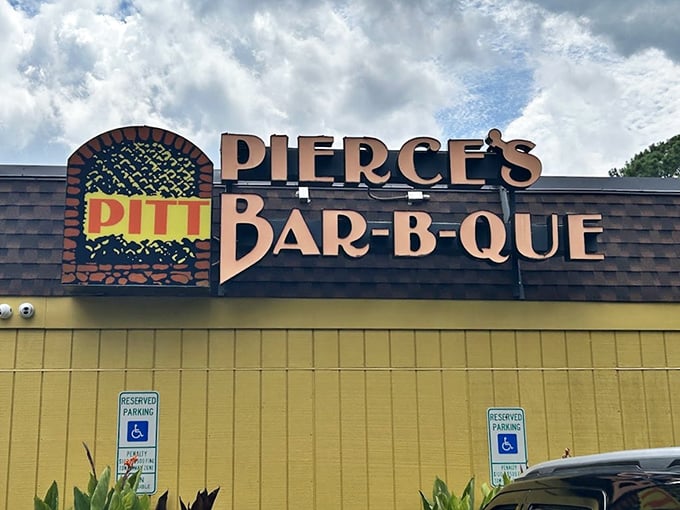 Welcome to barbecue paradise! Pierce's Pitt Bar-B-Que's vibrant yellow exterior is like a beacon for hungry souls seeking smoky salvation.