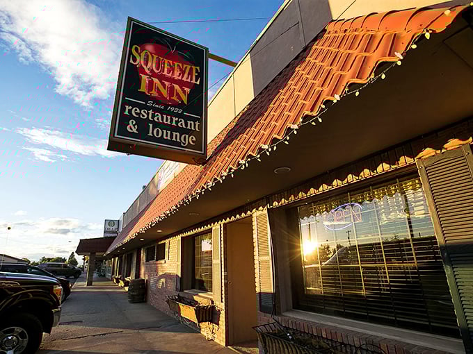 The Squeeze Inn: Where time-honored tradition meets mouthwatering steaks. This unassuming exterior hides a world of flavor waiting to be discovered.
