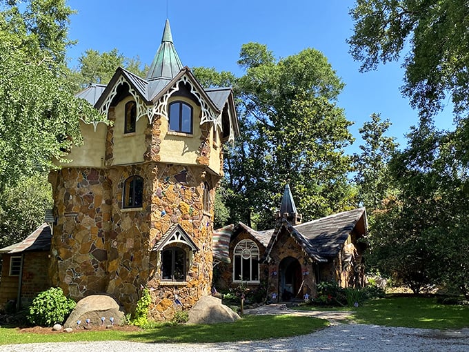 Fairy tales come to life! This whimsical stone castle, complete with a vibrant yellow wagon, looks like it was plucked straight from a storybook.