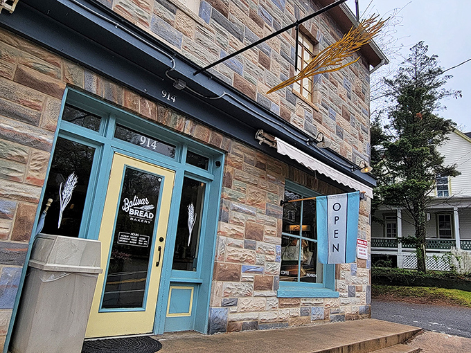 Stone-cold stunner! This historic facade houses a bakery that's anything but old-fashioned. Warm light and laughter spill onto the street, inviting you in.