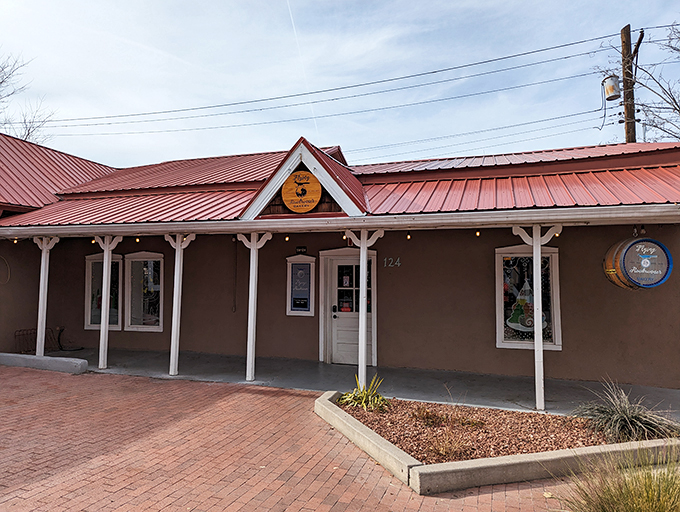 Welcome to carb heaven! The Flying Roadrunner Bakery's charming exterior promises a feast for the senses, with its inviting porch and rustic charm.