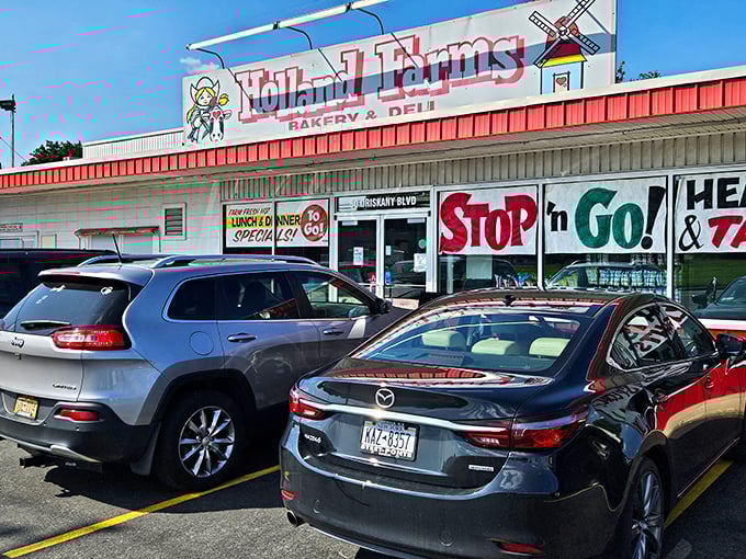 Welcome to carb heaven! Holland Farms' iconic storefront beckons with promises of sugary delights and deli dreams. It's like Willy Wonka opened a bakery in small-town America.