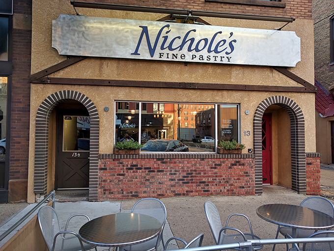 A beacon of buttery bliss! Nichole's Fine Pastry stands proud, its arched doorways promising sweet salvation to weary downtown wanderers.
