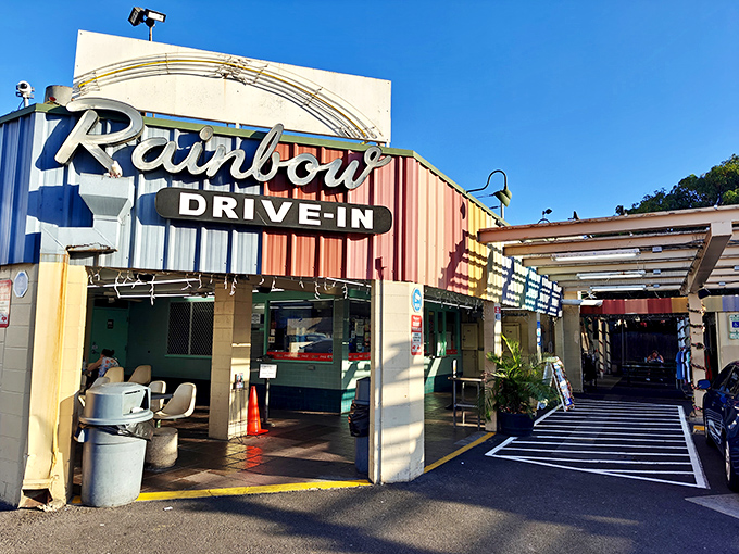 Welcome to flavor paradise! Rainbow Drive-In's iconic sign promises a technicolor taste adventure that'll make your taste buds do the hula.