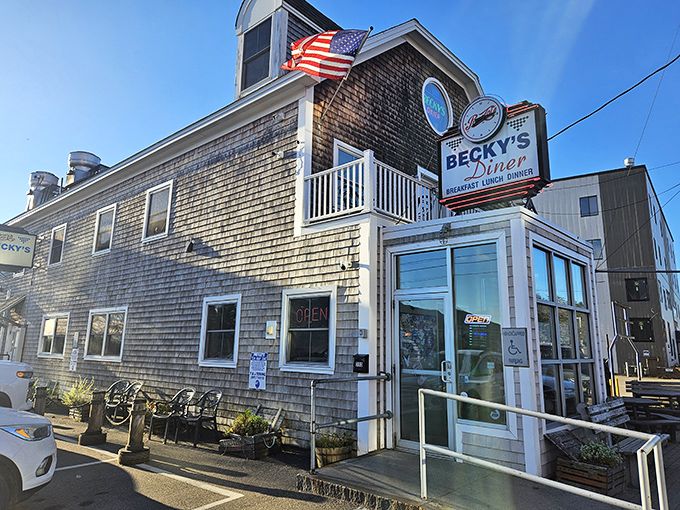A slice of Americana with a side of sea breeze! This charming shingle-clad diner beckons like a lighthouse for hungry souls.