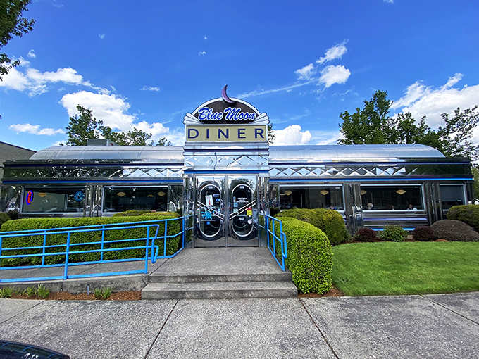 Step into a time machine disguised as a diner! The Blue Moon's gleaming exterior promises a journey back to the golden age of American cuisine.