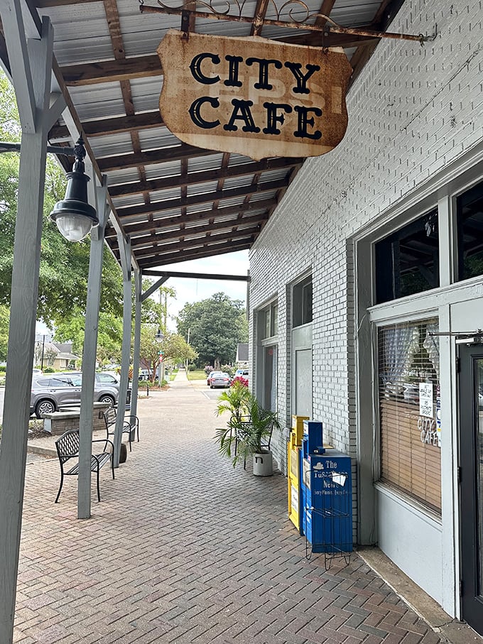 Step into a time machine disguised as a diner! City Cafe's weathered sign promises a journey back to simpler times and hearty meals. 