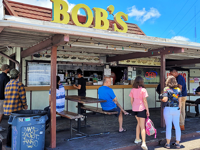 Welcome to Bob's, where the yellow sign shines brighter than a Hawaiian sunset. This no-frills spot is where barbecue dreams come true.
