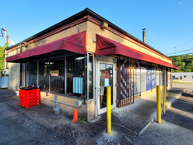 Like a barbecue lighthouse beckoning hungry souls, LC's modest exterior with its red awning and yellow poles promises smoky delights within.
