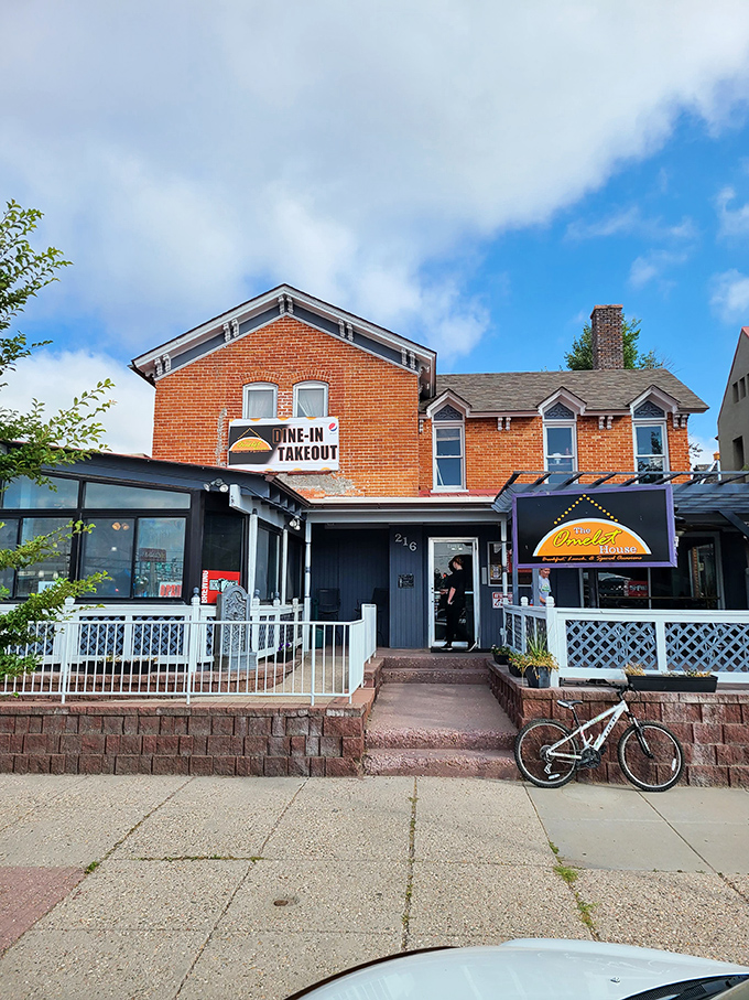 A brick-and-mortar love letter to breakfast! The Omelet House stands proud, its sign a beacon of hope for the hungry and hung-over alike.