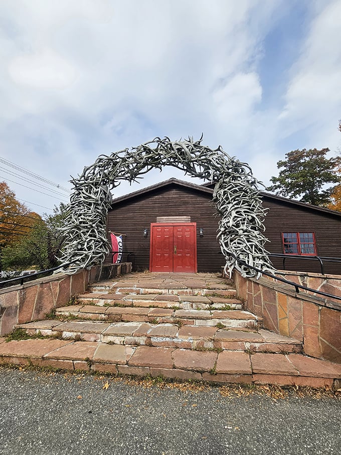 Welcome to the Cow Palace, where antlers aren't just decorations &ndash; they're a way of life! This entrance arch is like a bovine Stonehenge, beckoning you to a world of rustic charm and hearty eats.