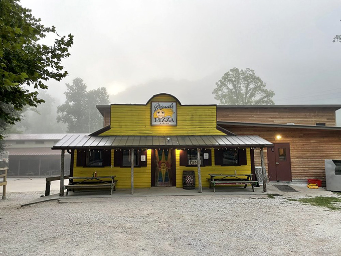A splash of sunshine in the Kentucky woods! Miguel's Pizza stands out like a beacon of cheesy goodness, beckoning hungry adventurers with its vibrant yellow facade.