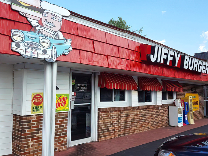 Welcome to burger paradise! Jiffy Burger's retro exterior promises a trip back in time, complete with friendly dinosaurs guarding the entrance.